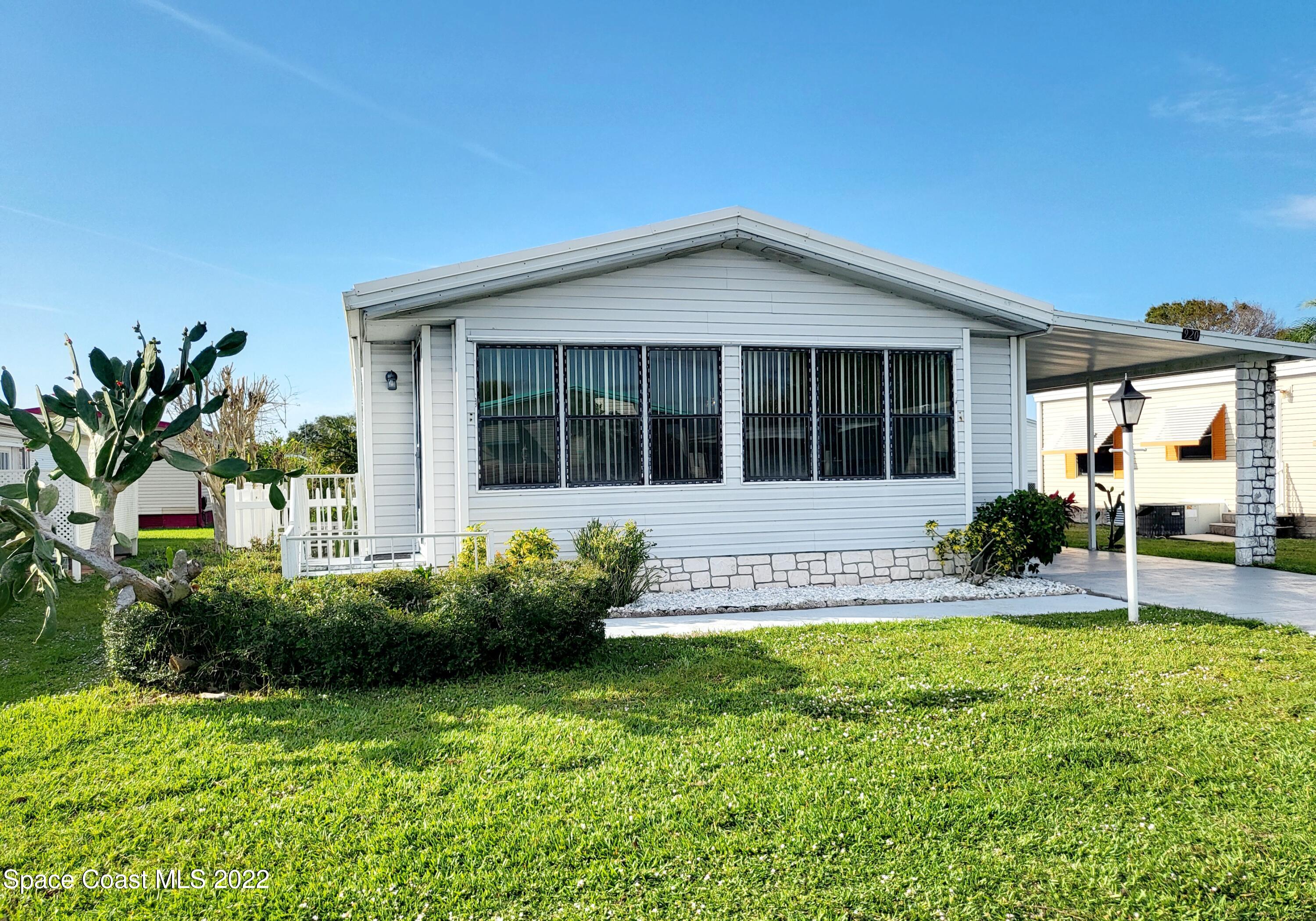 920 Hyacinth Circle, Barefoot Bay, FL 32976 | Compass